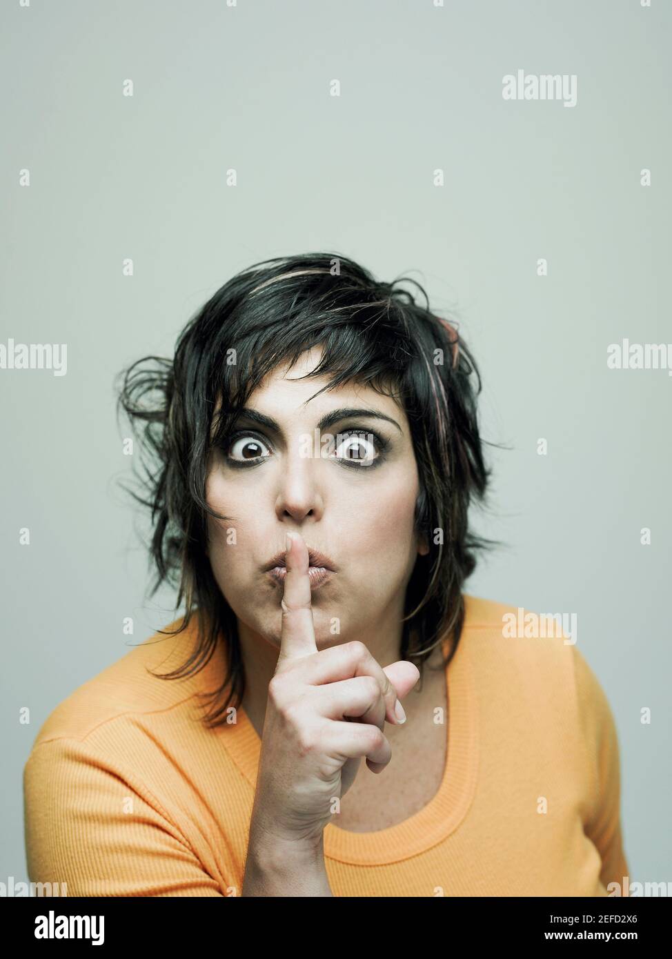 Finger on lips middle aged hi-res stock photography and images - Alamy