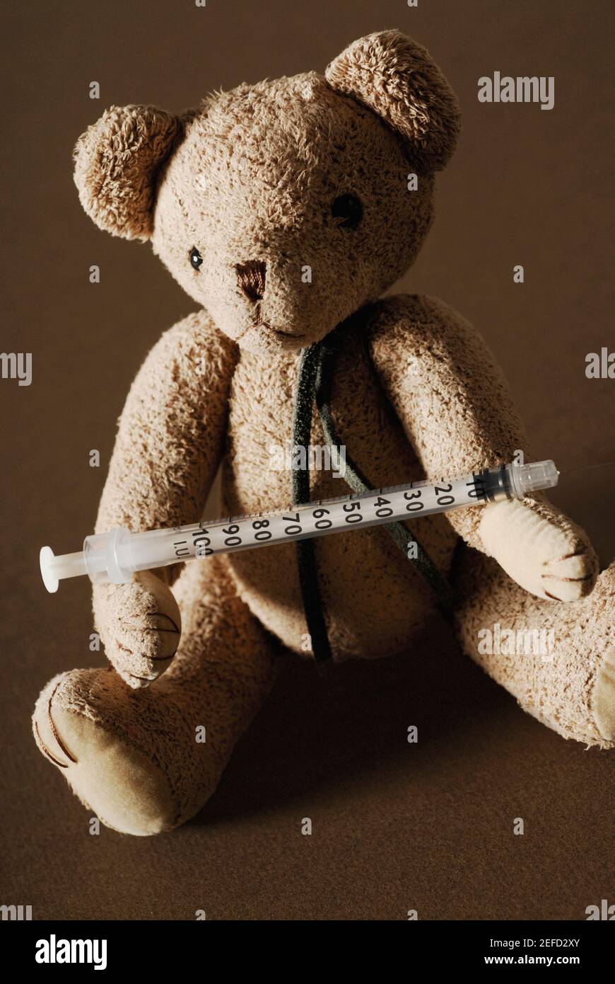 Close up of a teddy bear with an injection Stock Photo - Alamy