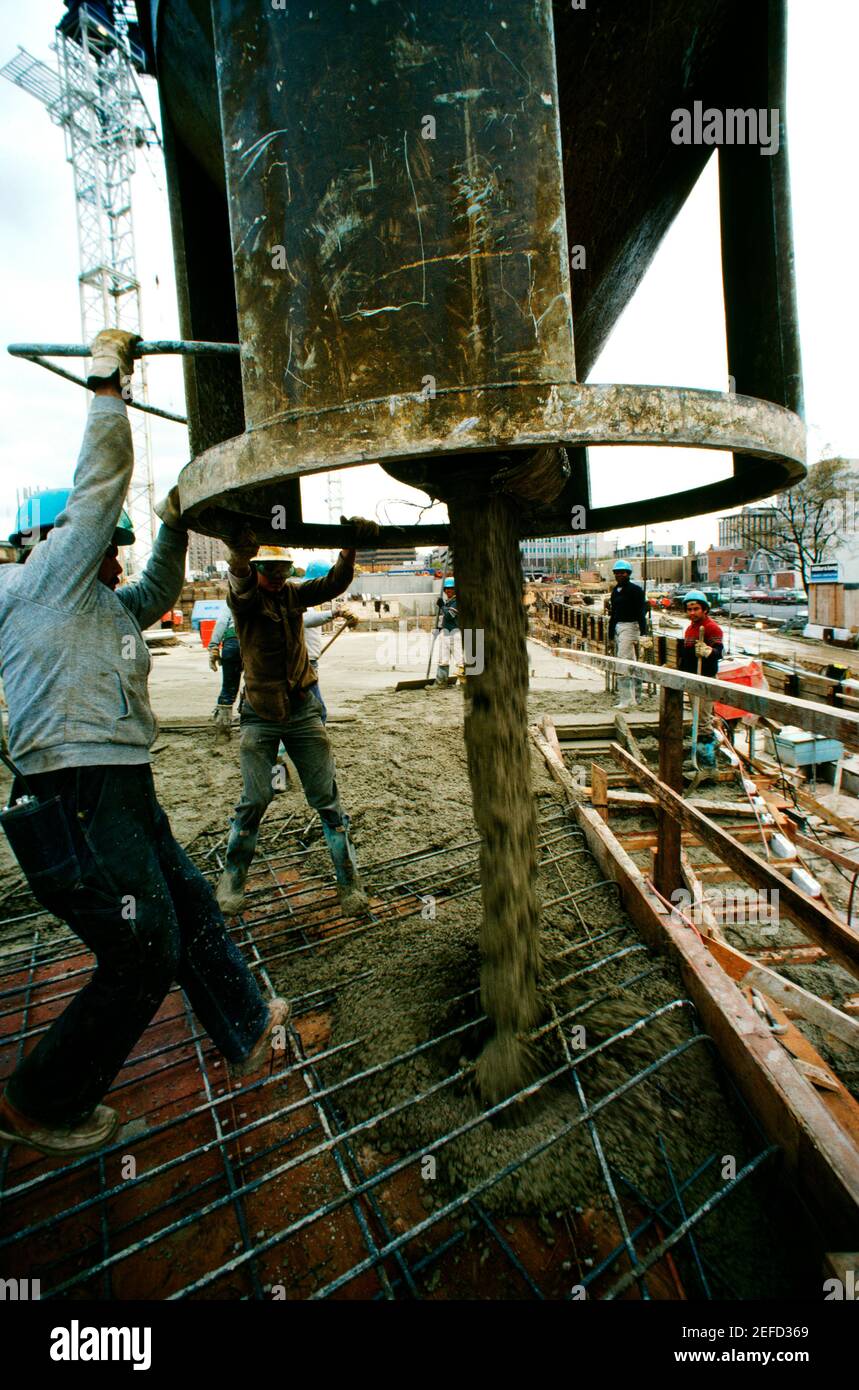 Construction workers pouring cement in new Office building in Bethesda ...