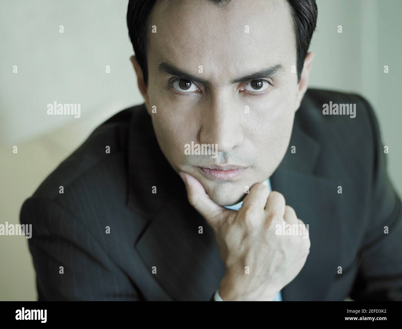 Portrait of a businessman thinking Stock Photo - Alamy