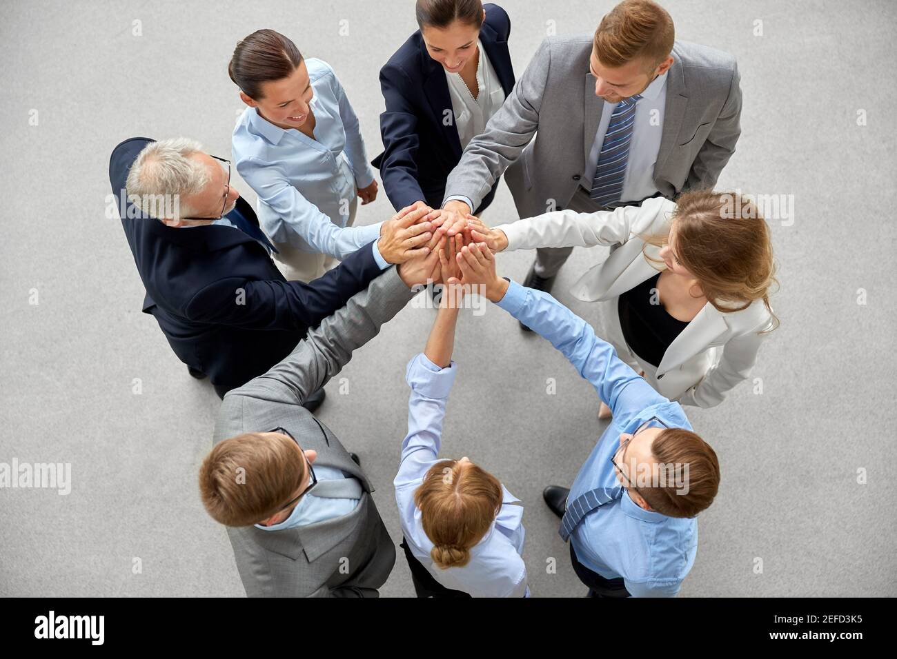 business people making high five in office Stock Photo - Alamy