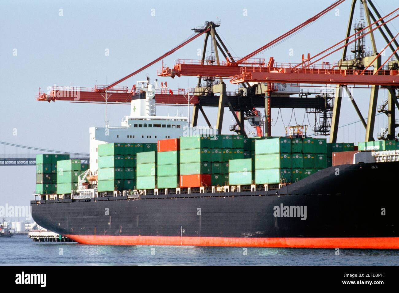 Container ship being unloaded at a dock Stock Photo - Alamy
