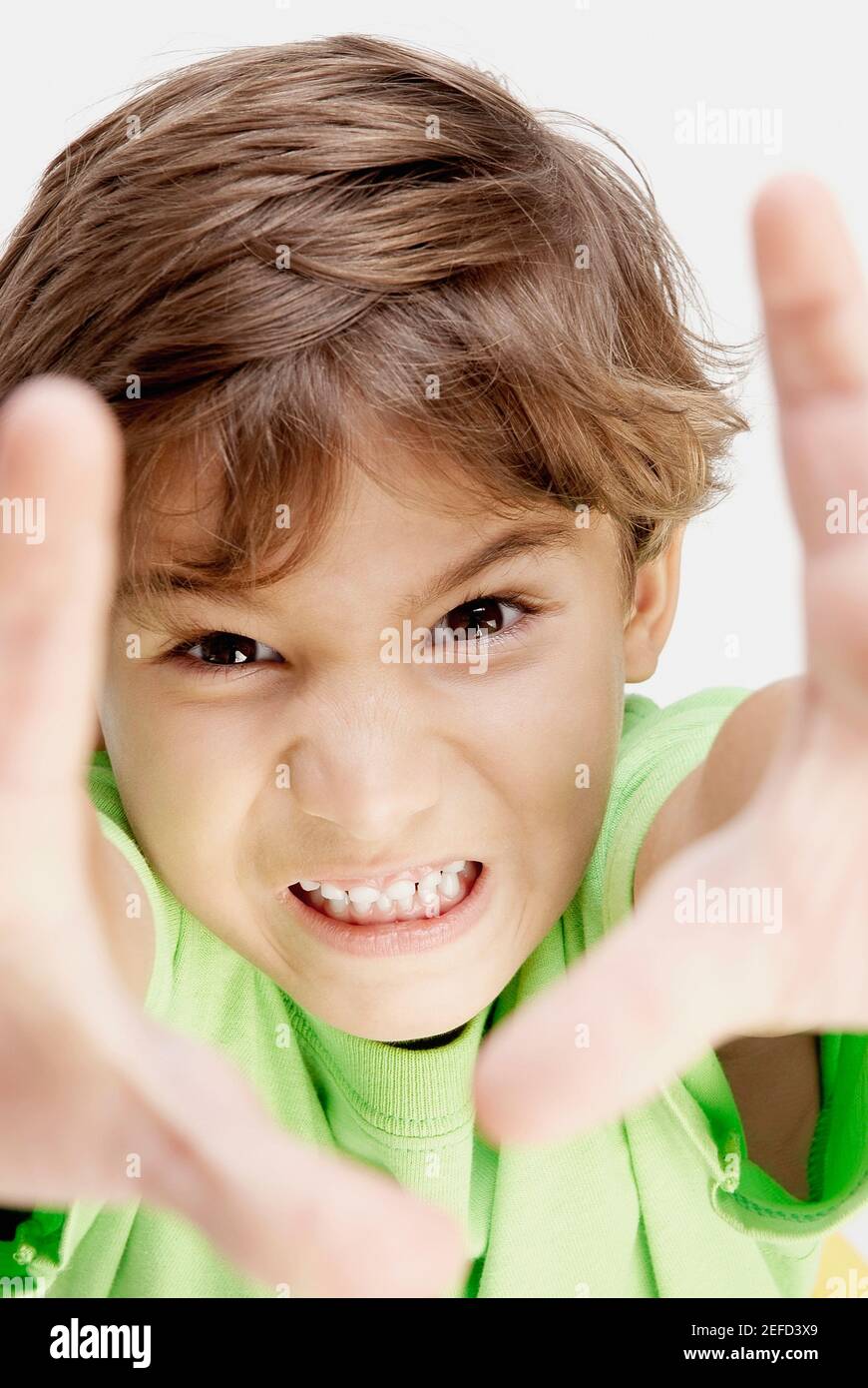 Portrait of a boy clenching his teeth Stock Photo - Alamy
