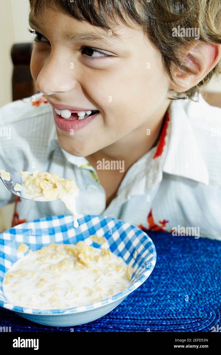 Boy eating cornflakes for breakfast hi-res stock photography and images ...