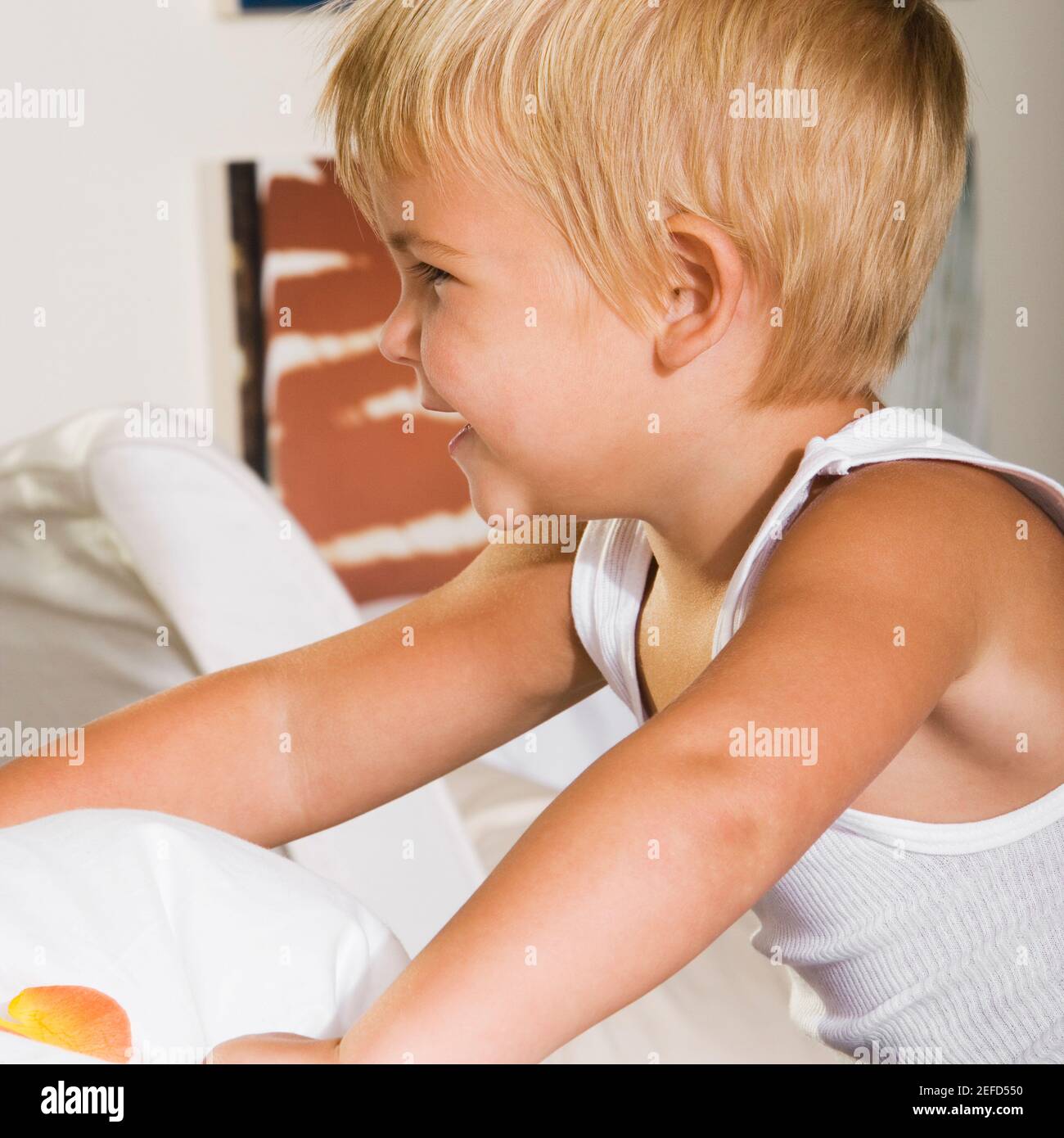 Side profile of a boy smiling Stock Photo - Alamy