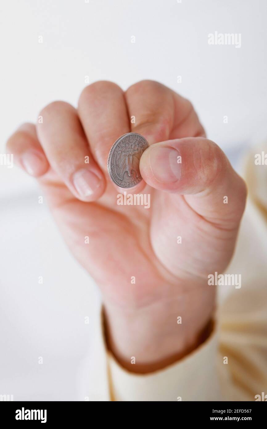 Hand holding a coin hi-res stock photography and images - Alamy