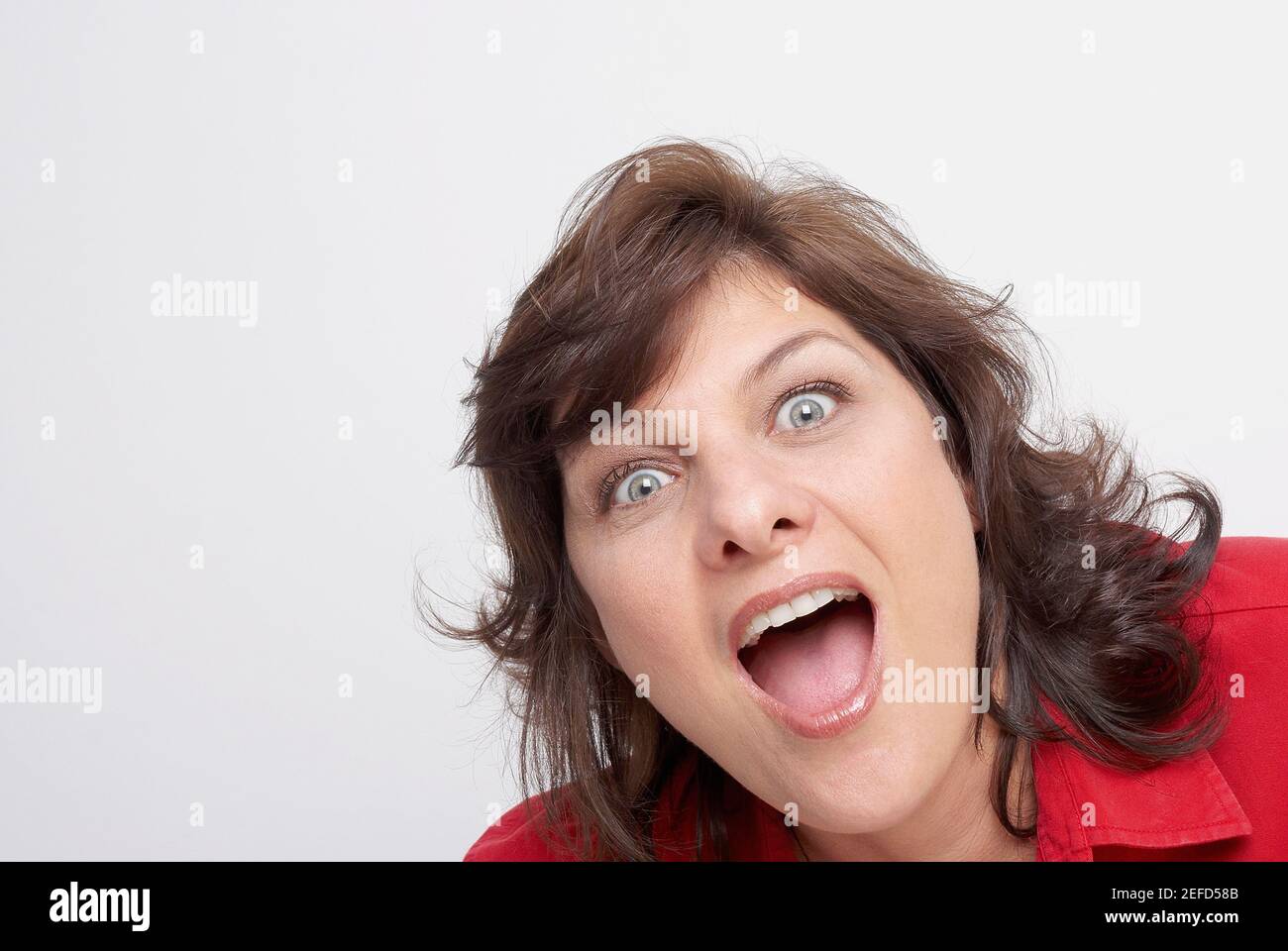 Portrait of a mature woman shouting Stock Photo - Alamy