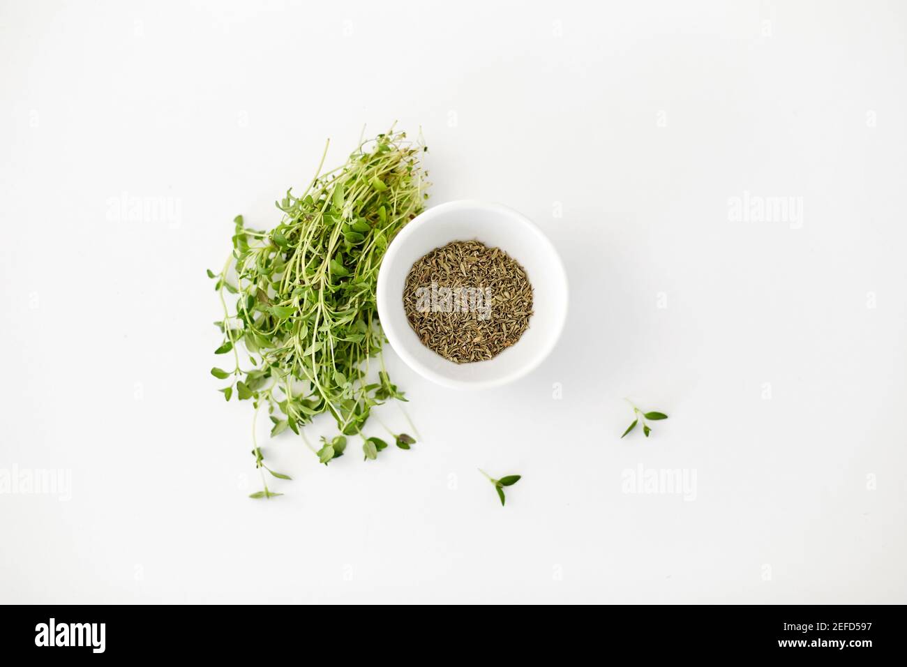 fresh thyme and dry seasoning on white background Stock Photo - Alamy