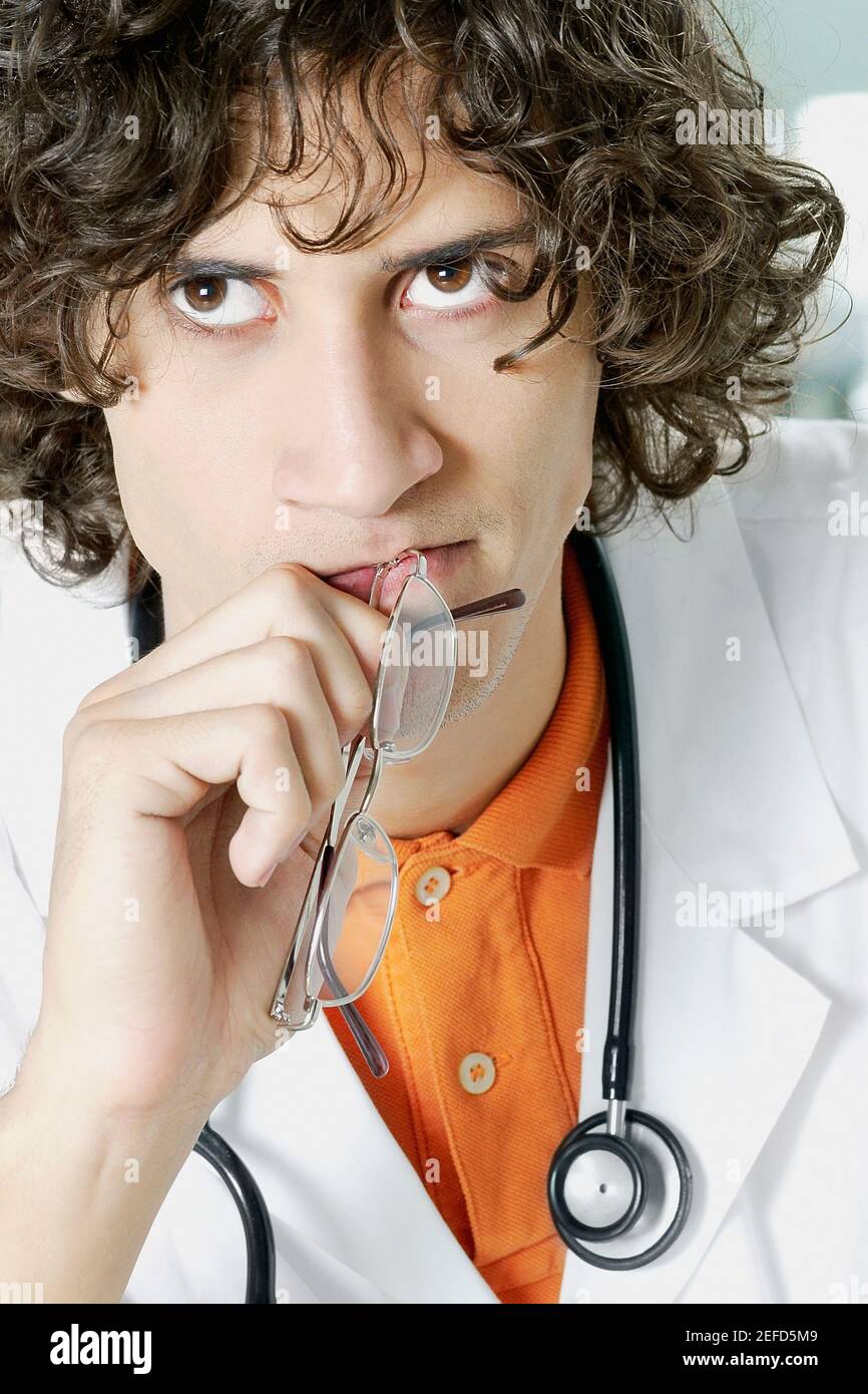 Serious young latin doctor hi-res stock photography and images - Alamy