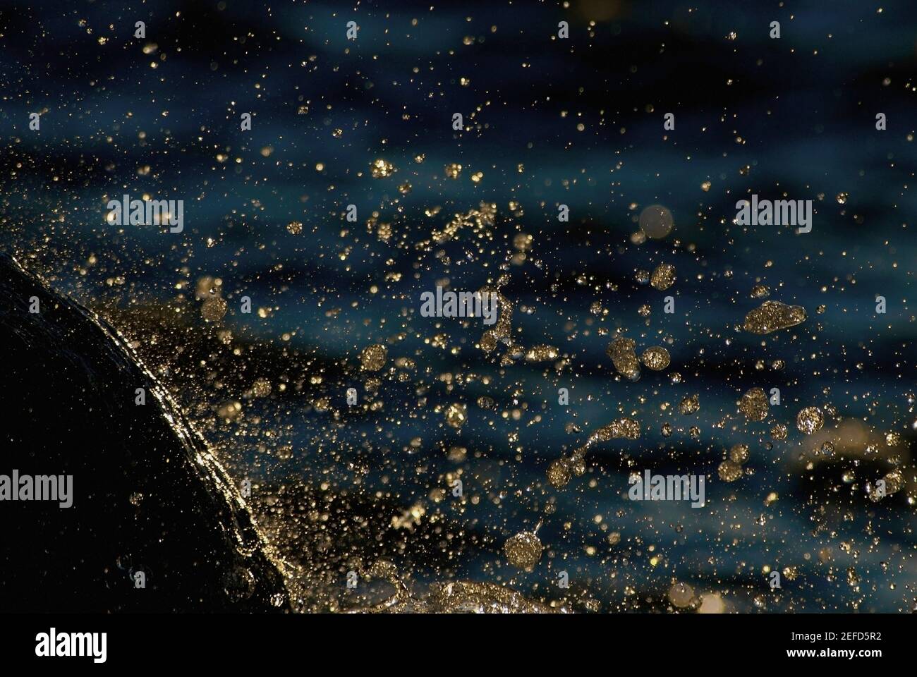 Close up water splashing against rock hi-res stock photography and ...