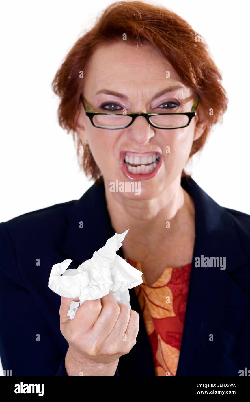 Portrait of a businesswoman crushing paper Stock Photo - Alamy
