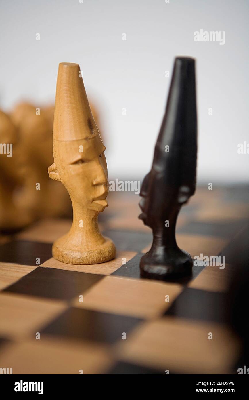 Close up of two chess pieces on a chessboard Stock Photo - Alamy
