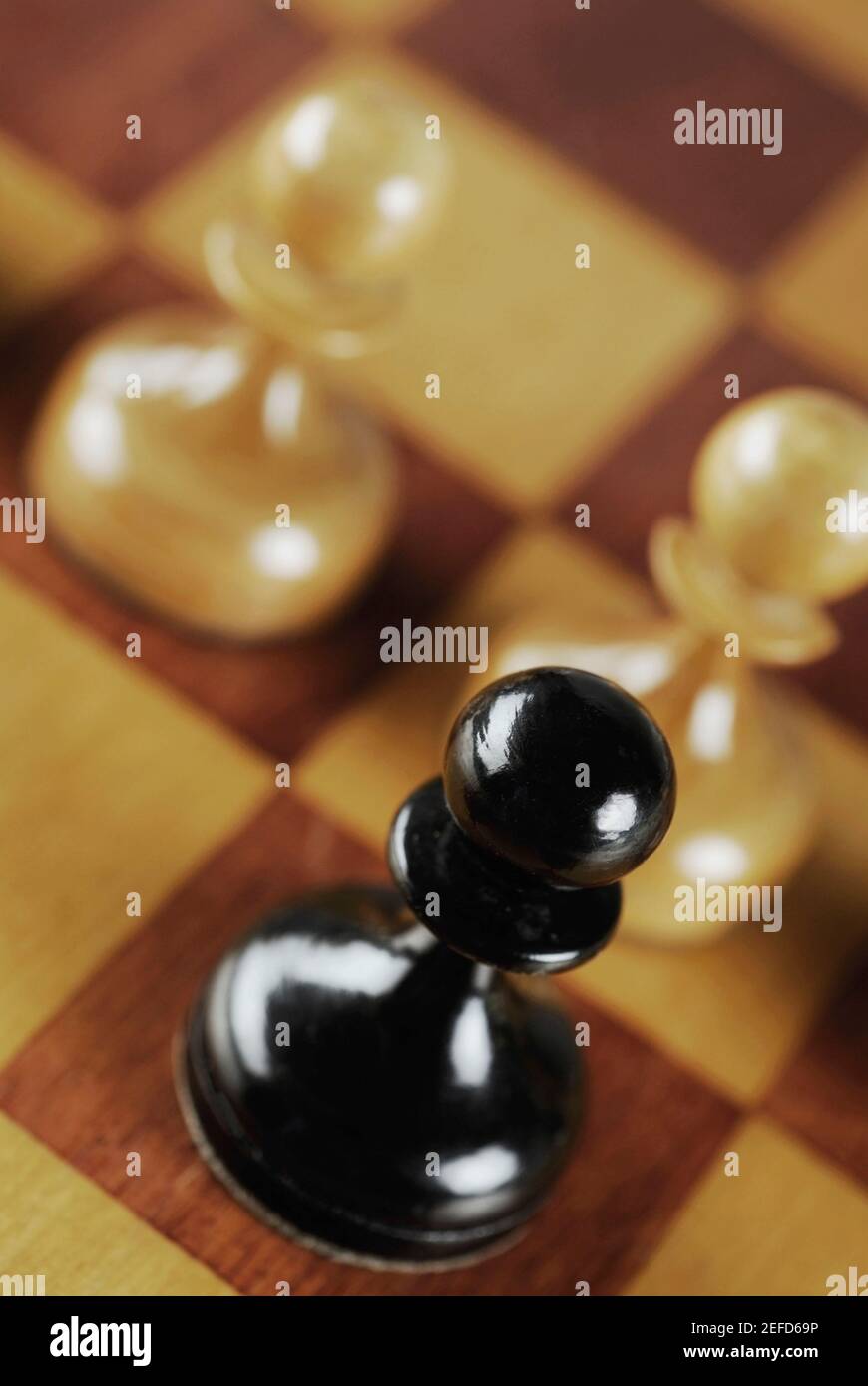 High angle view of three chess pieces on a chessboard Stock Photo - Alamy