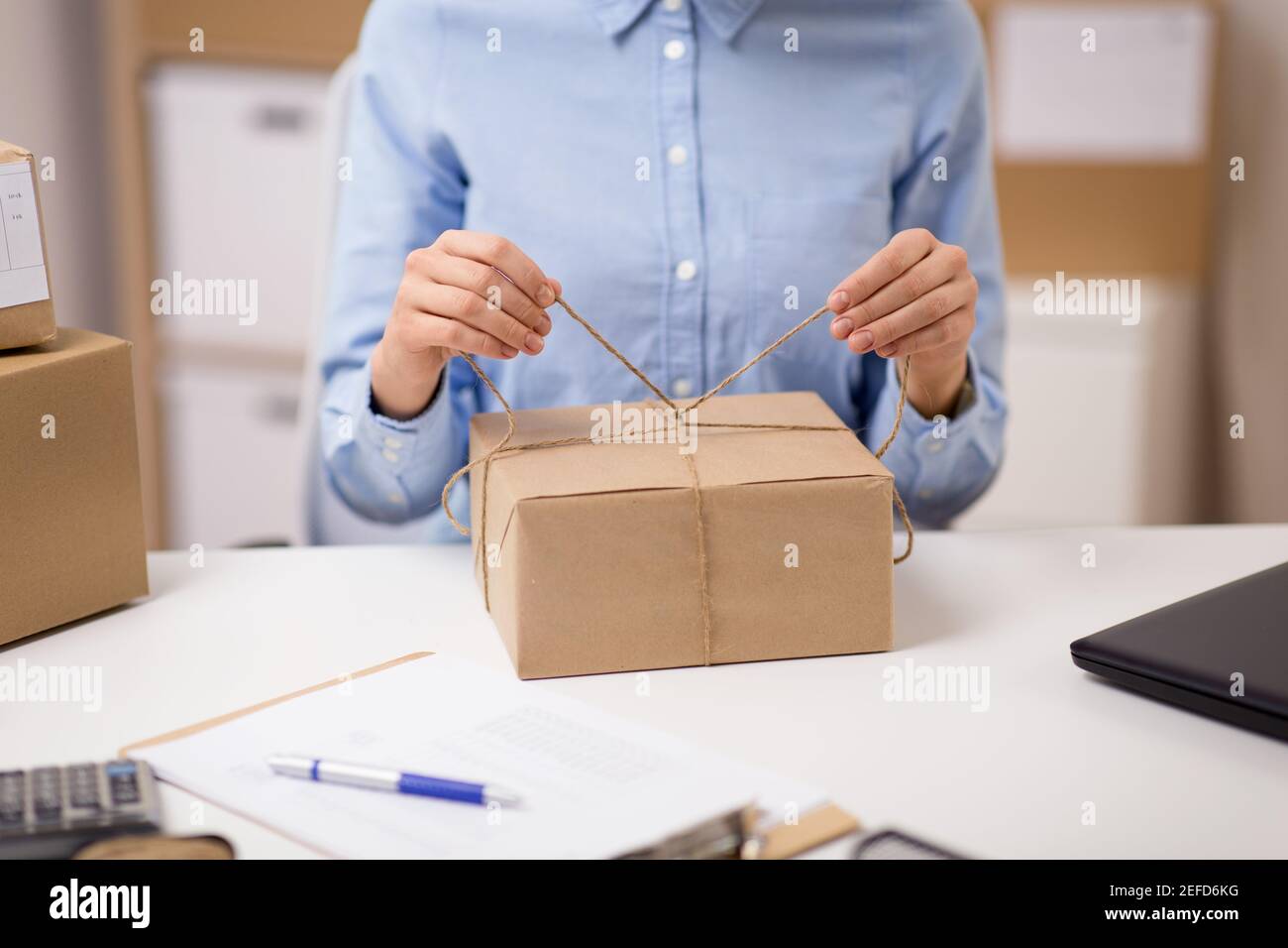 Woman tying rope hi-res stock photography and images - Alamy