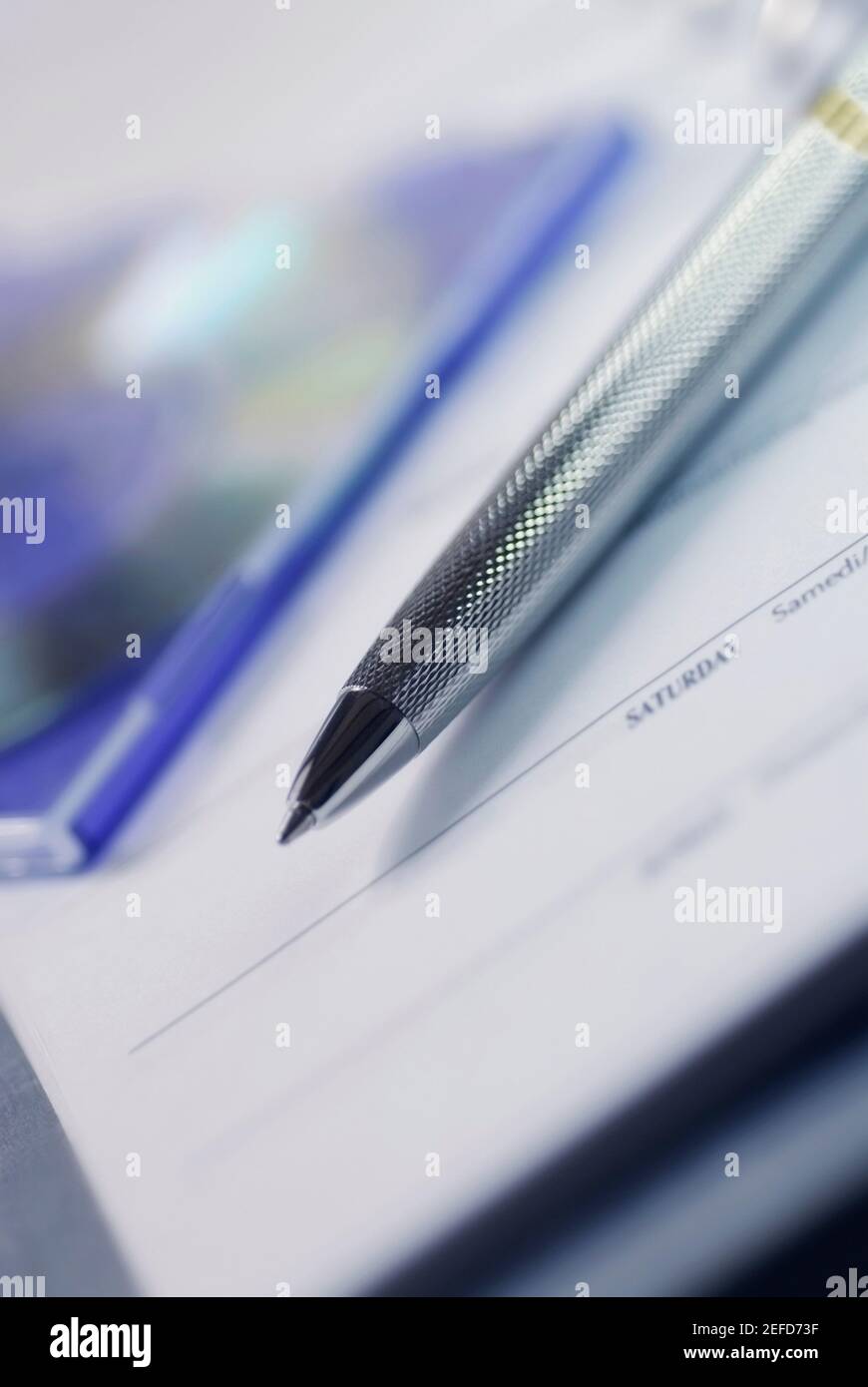 Close up of a ballpoint pen and CD case on a sheet of paper Stock Photo ...