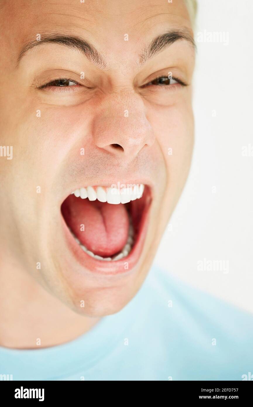Portrait of a young man screaming Stock Photo - Alamy