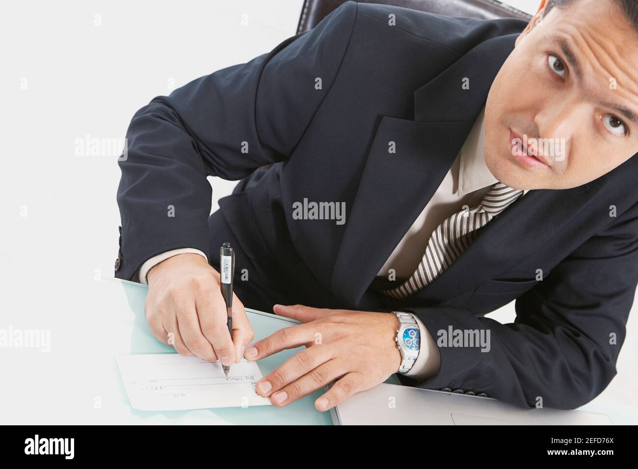 Portrait businessman writing check hi-res stock photography and images ...