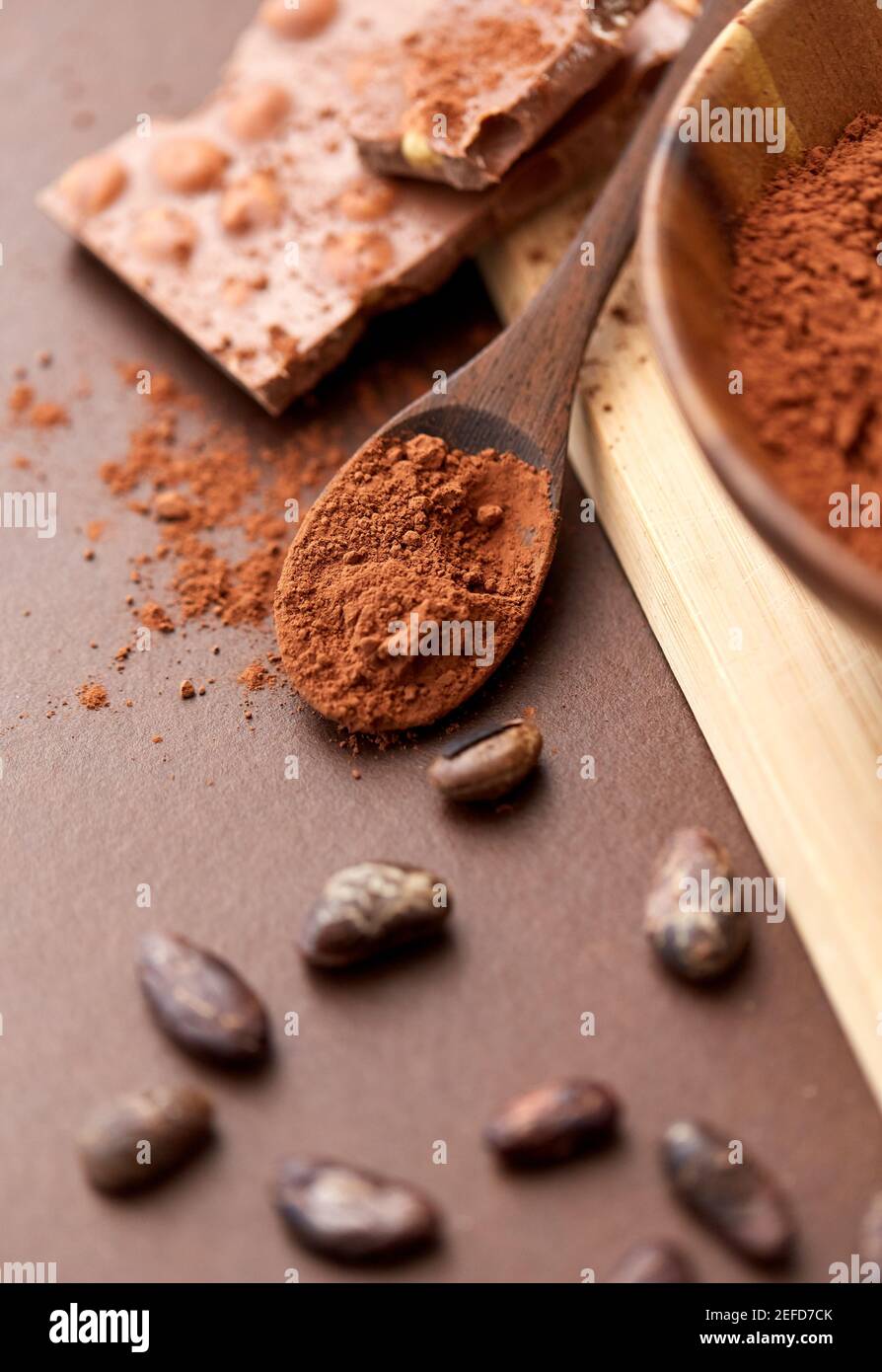 chocolate with hazelnuts, cocoa beans and powder Stock Photo - Alamy