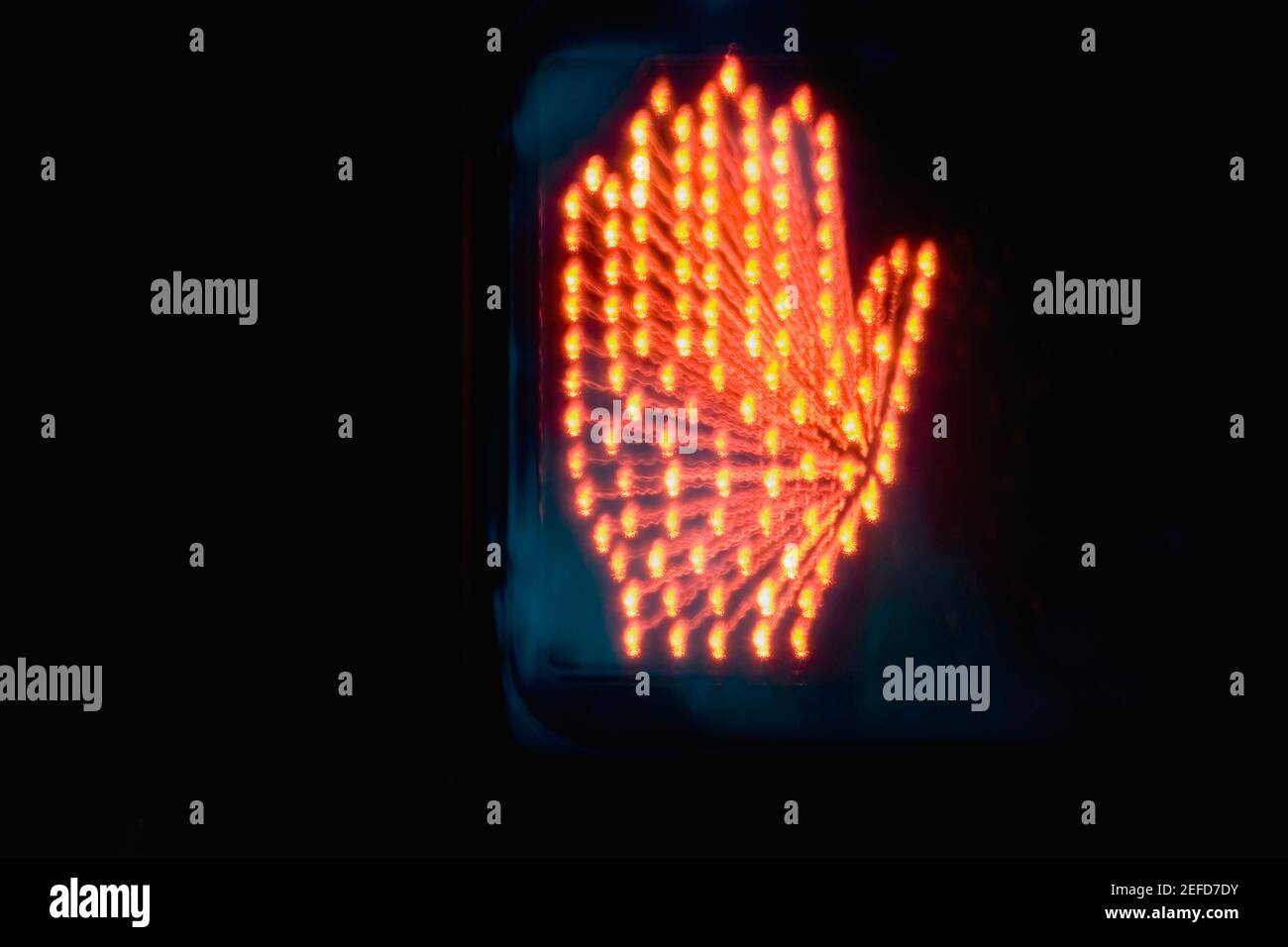 Stop sign lit up at night Stock Photo - Alamy
