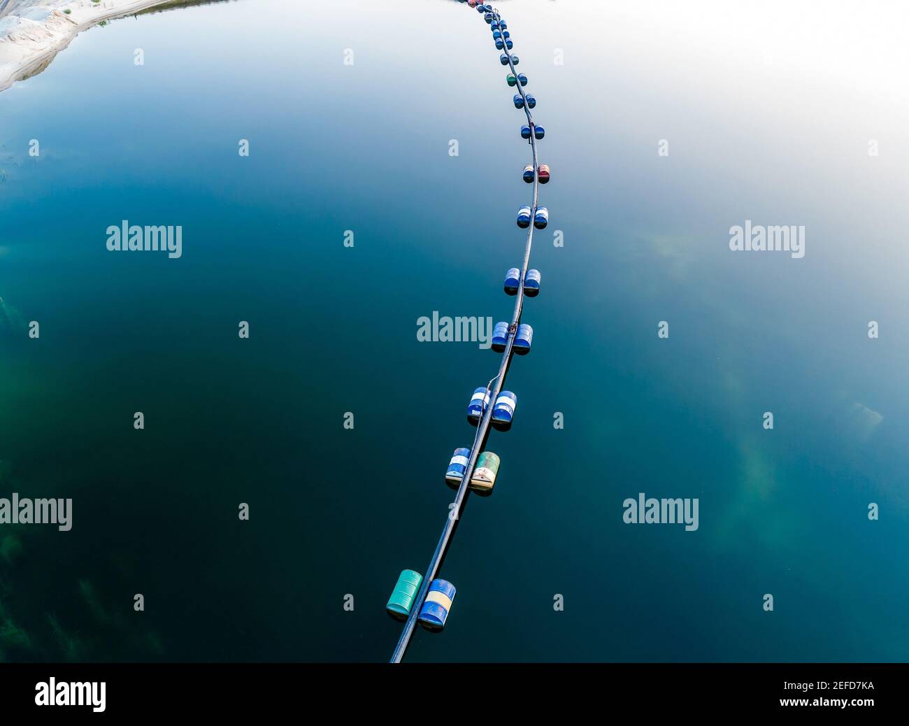 Aerial view of blue tube with barrels on the deep navy blue lake Stock ...