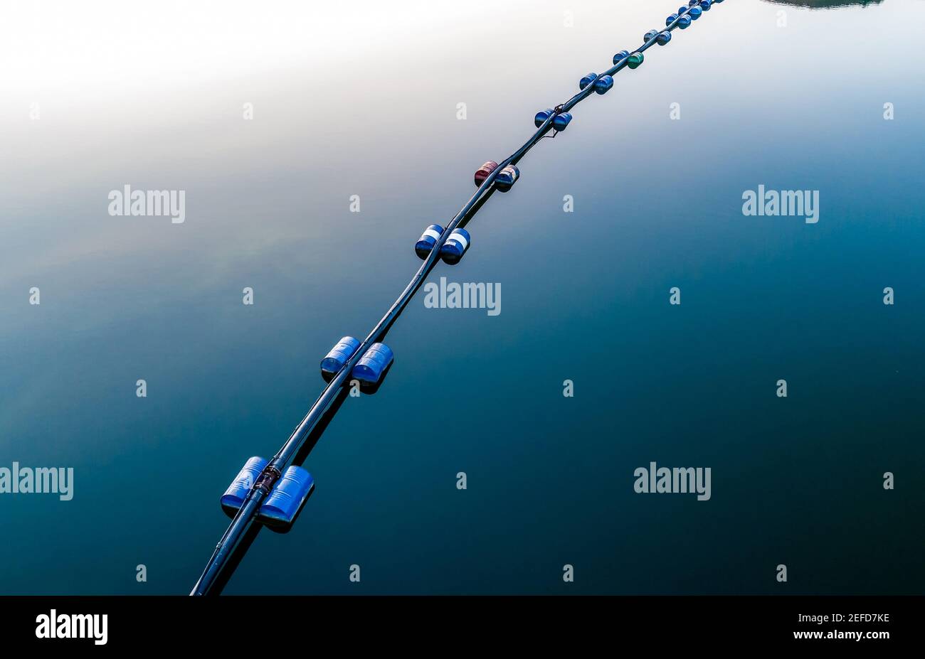 Aerial view of blue tube with barrels on the deep navy blue lake Stock ...