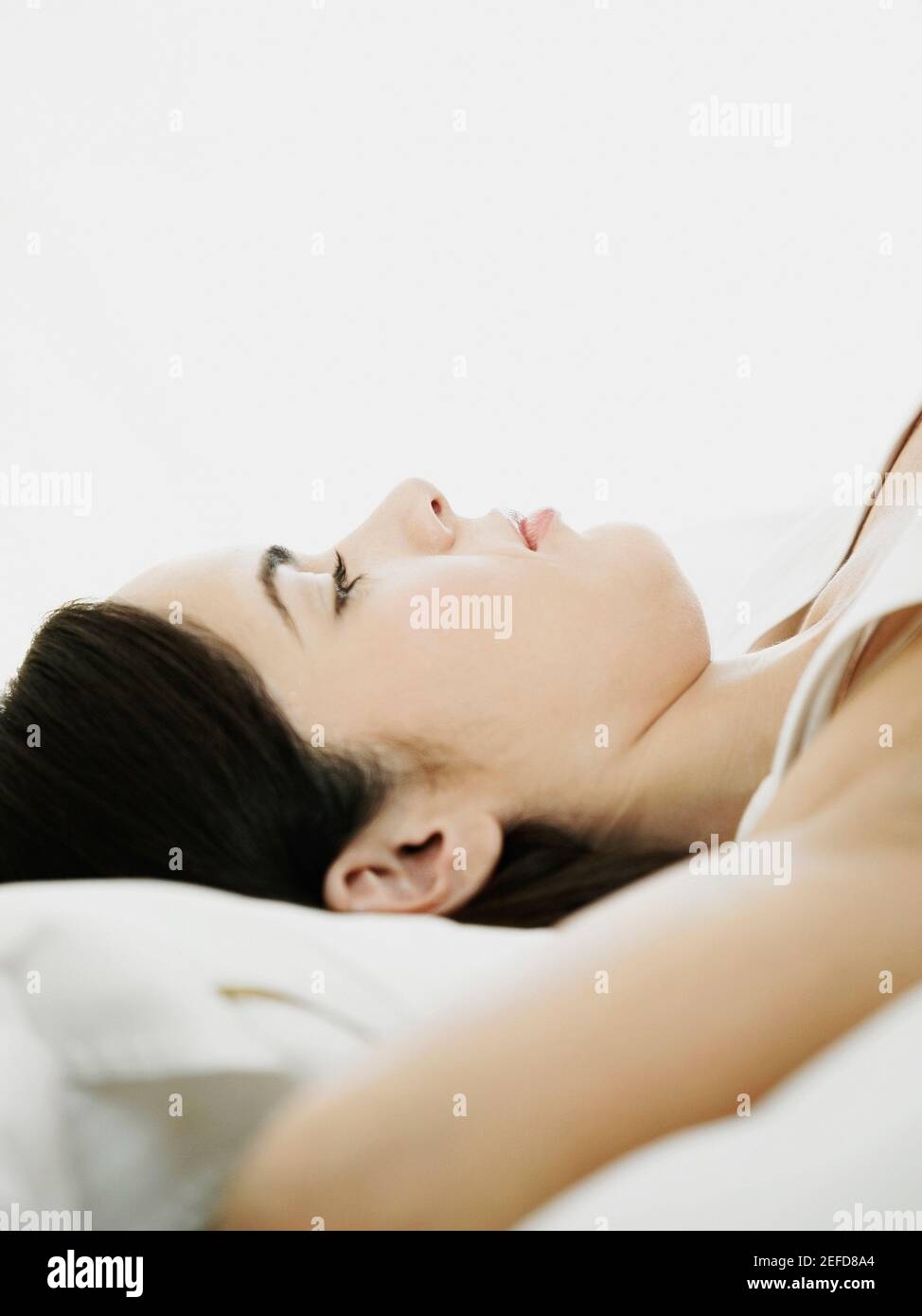 Side profile of a young woman lying on her back Stock Photo - Alamy