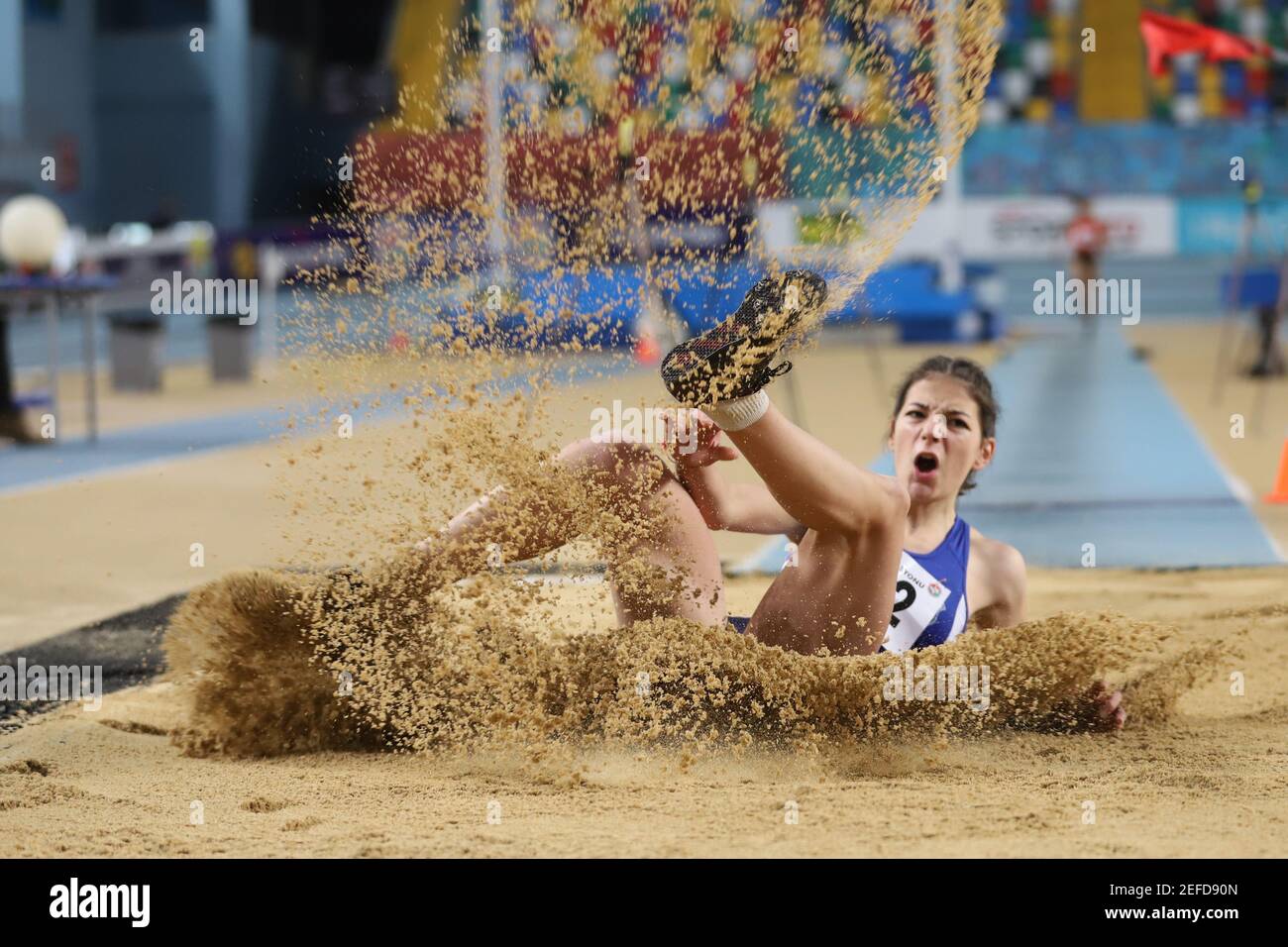 ISTANBUL, TURKEY - FEBRUARY 06, 2021: Undefined athlete long jumping ...