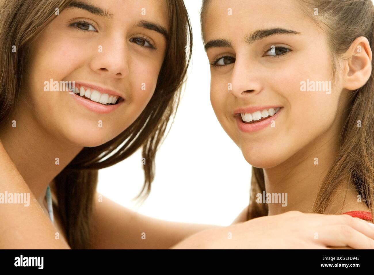 Portrait of two teenage girls hugging each other Stock Photo - Alamy