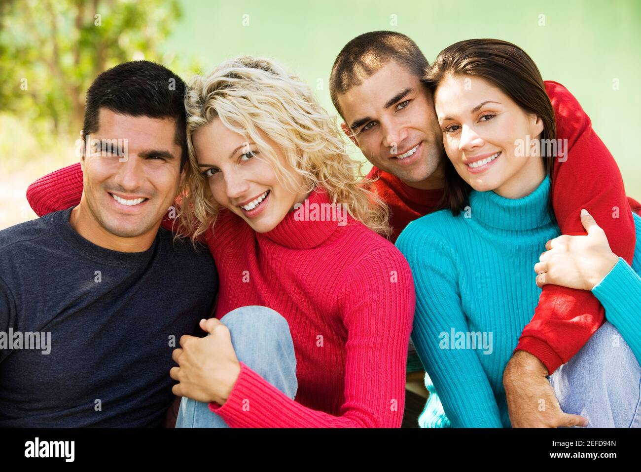 Portrait of four friends smiling Stock Photo - Alamy