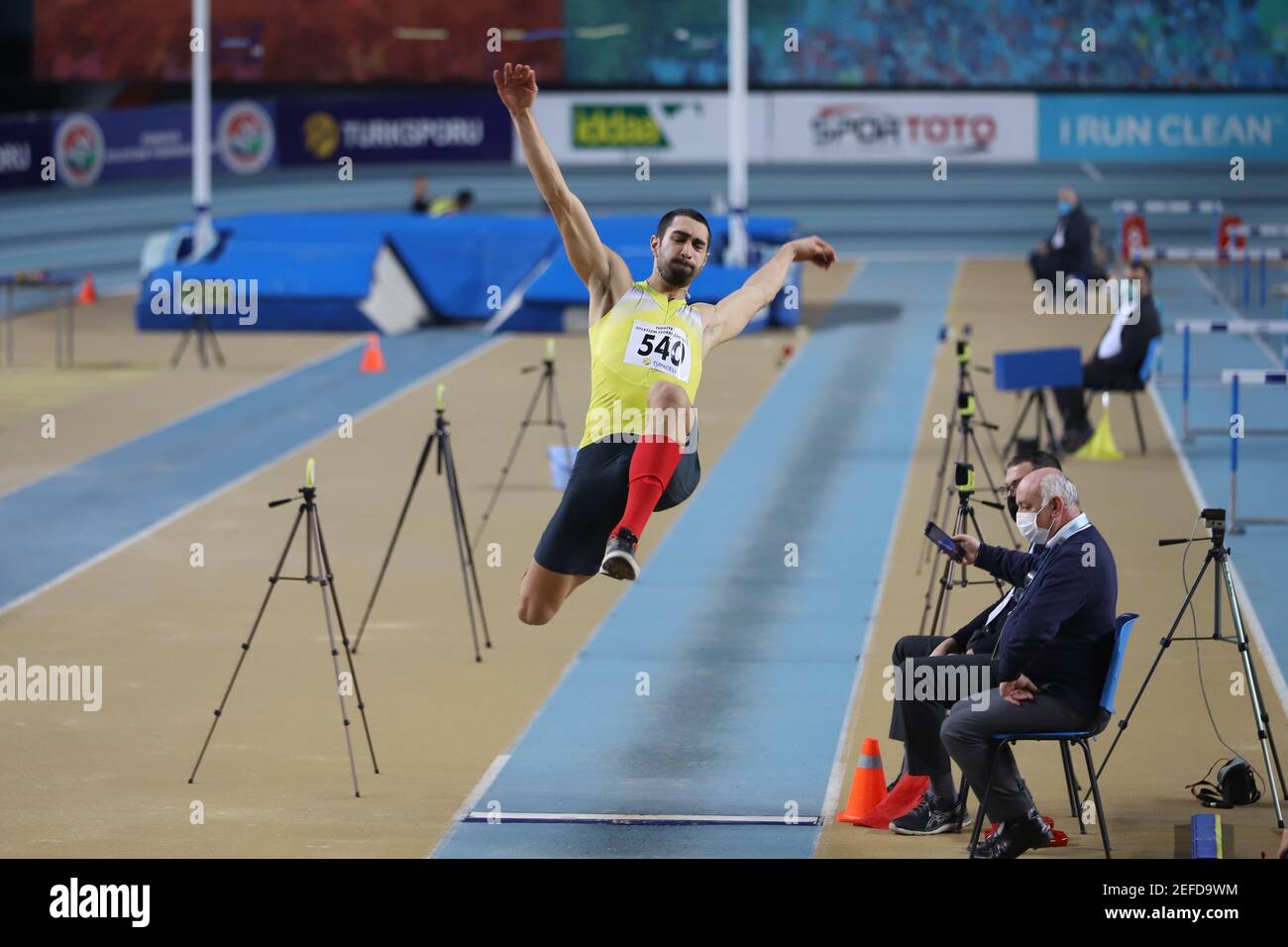 ISTANBUL, TURKEY - FEBRUARY 06, 2021: Undefined athlete long jumping ...