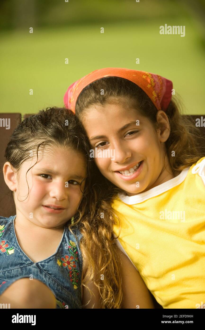 Portrait of two girls smiling Stock Photo - Alamy