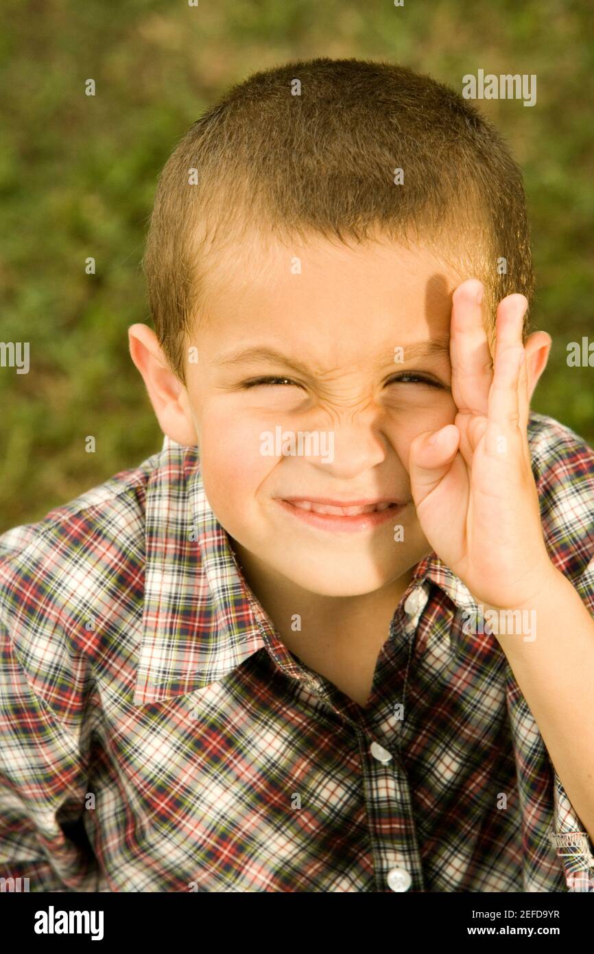 Portrait of a boy making a face Stock Photo - Alamy