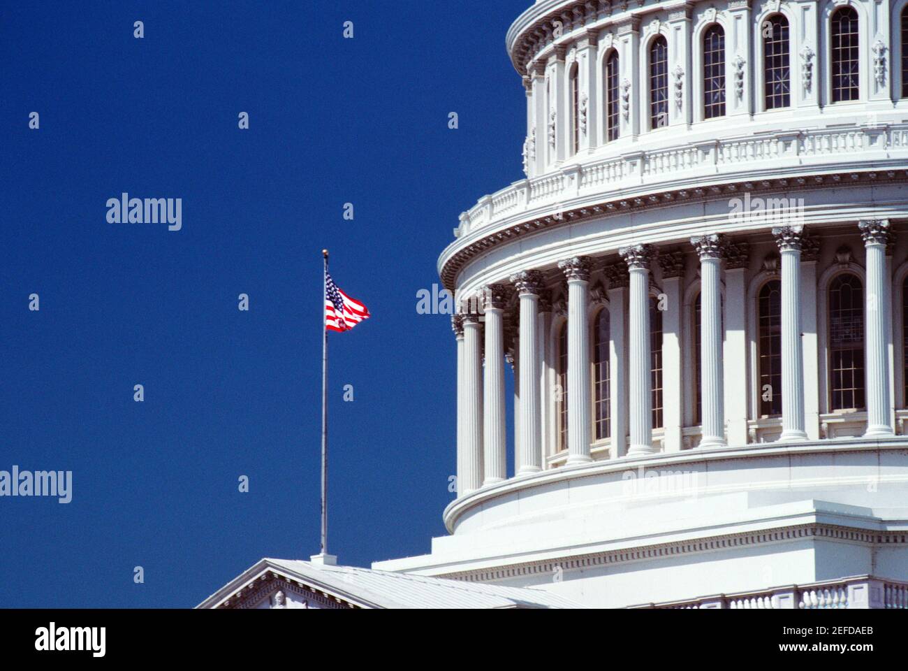 American flag in front of a government building, Capitol Building ...