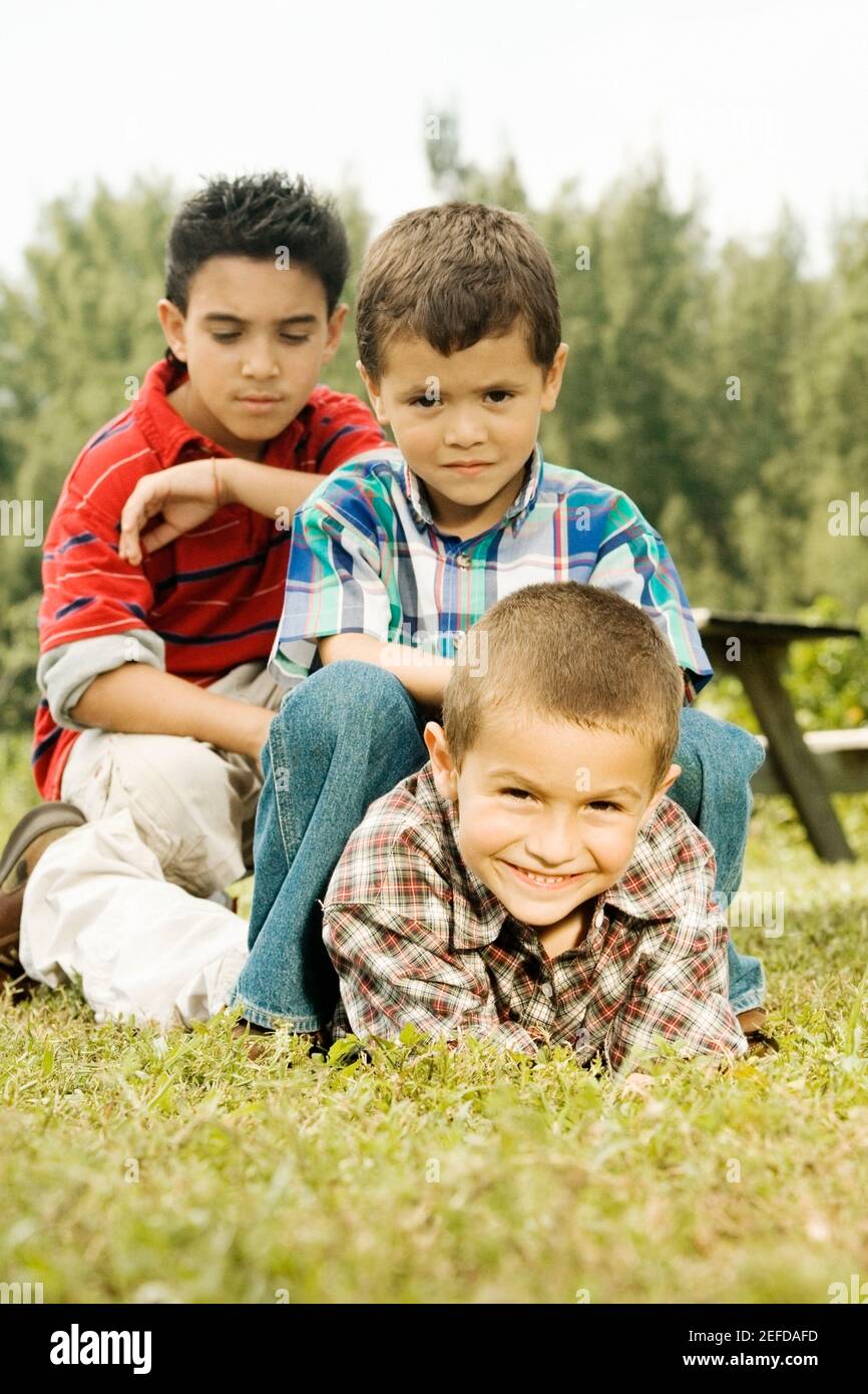 Three boys in the garden Stock Photo - Alamy