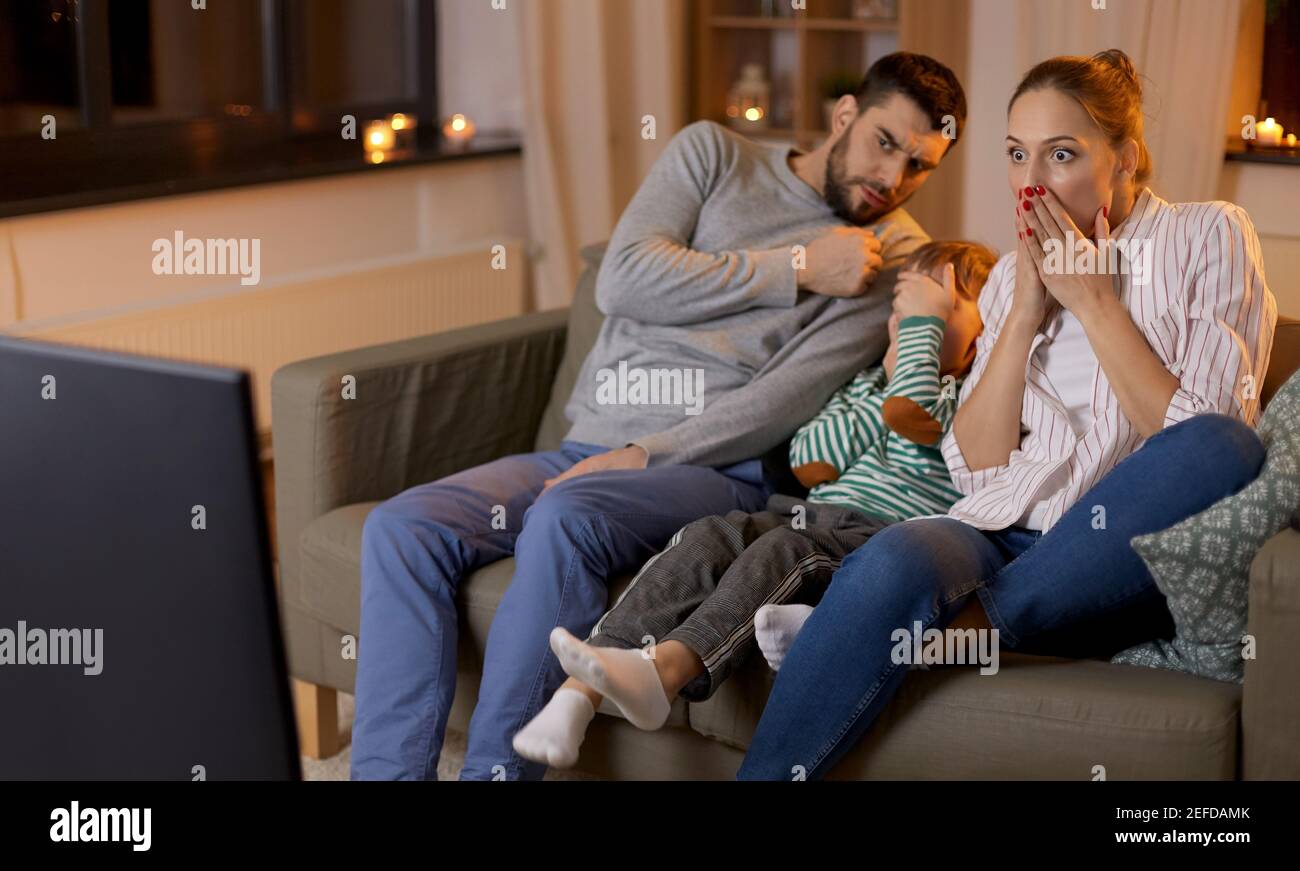 Boy watching tv scared hi-res stock photography and images - Alamy