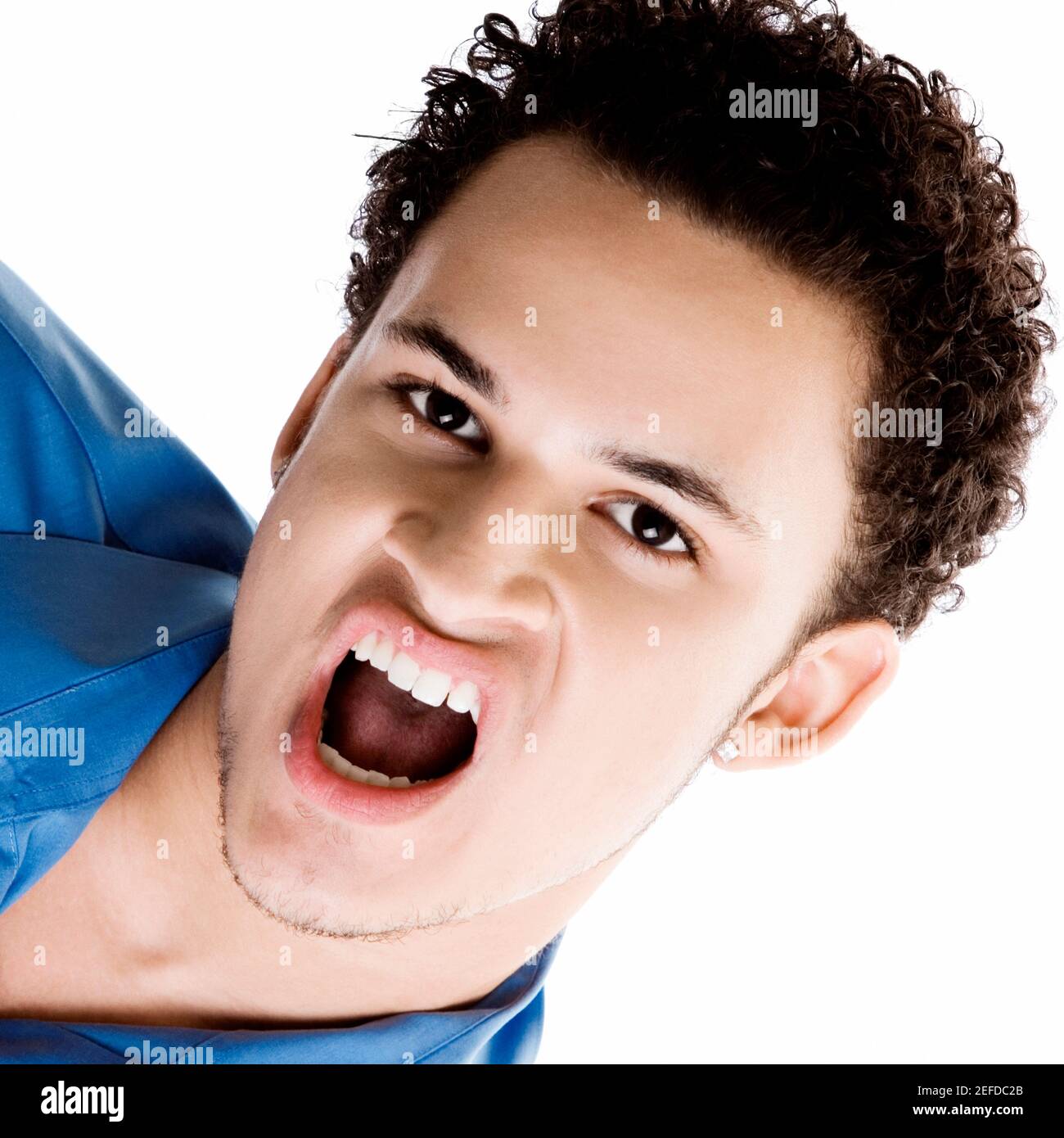 Portrait of a young man shouting Stock Photo - Alamy