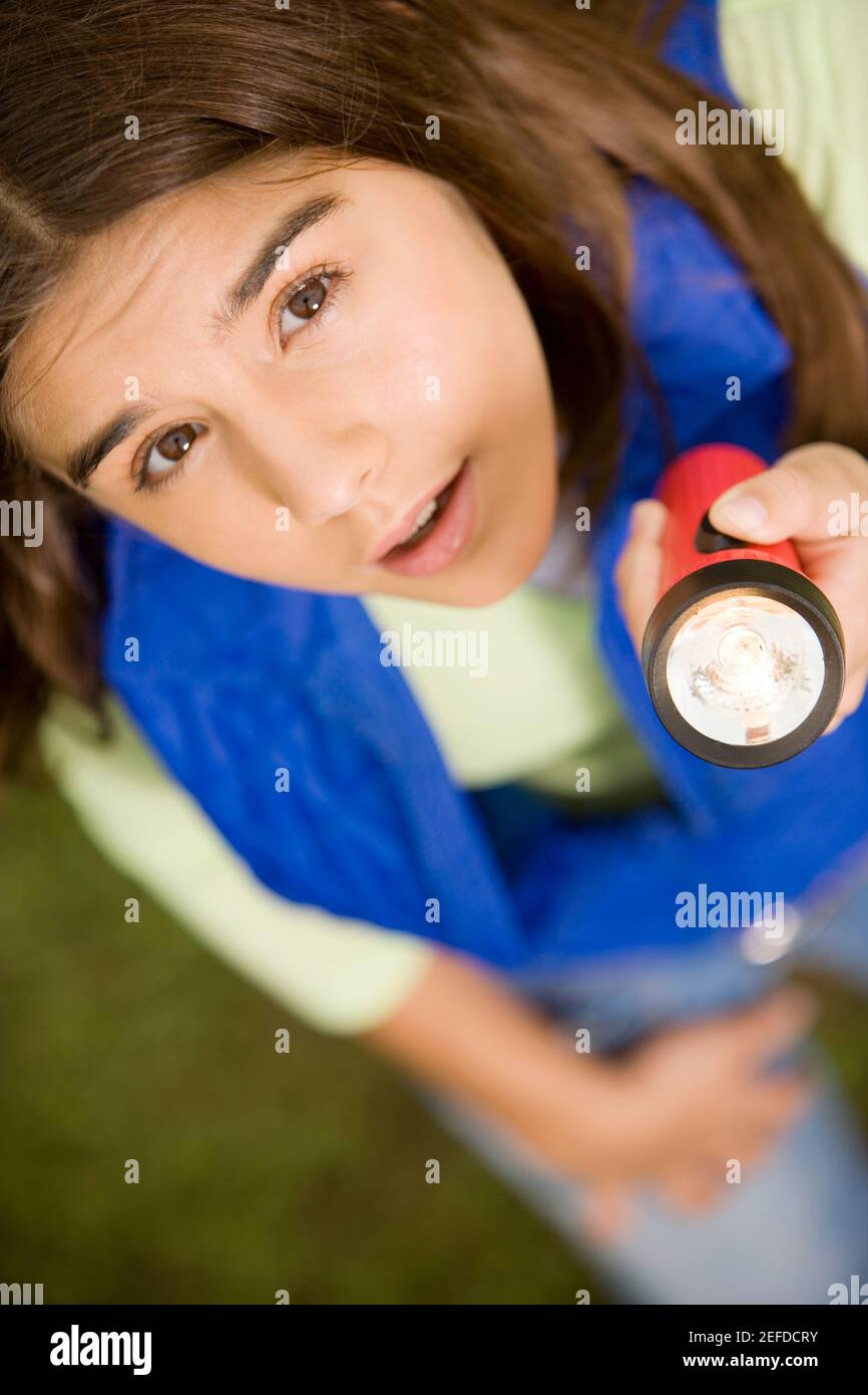 Child girl holding a torch hi-res stock photography and images - Alamy