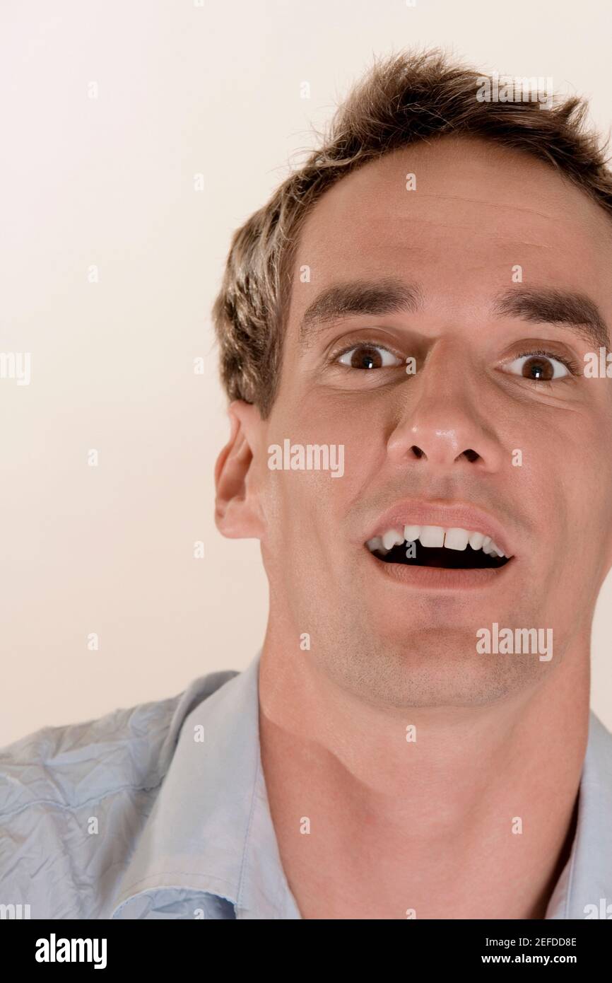 Portrait of a young man with his mouth open Stock Photo - Alamy