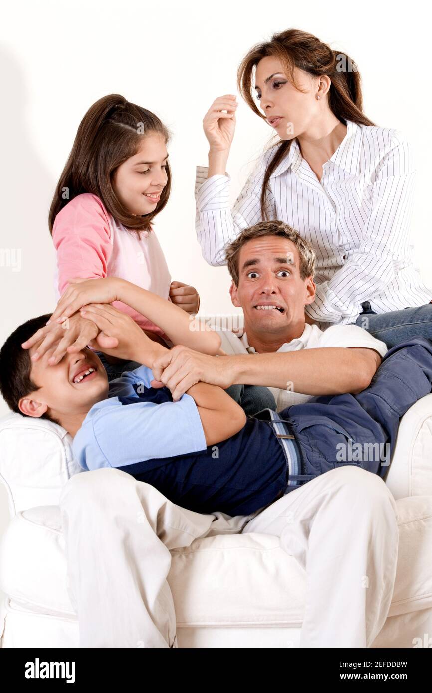 Parents and their two children Stock Photo - Alamy