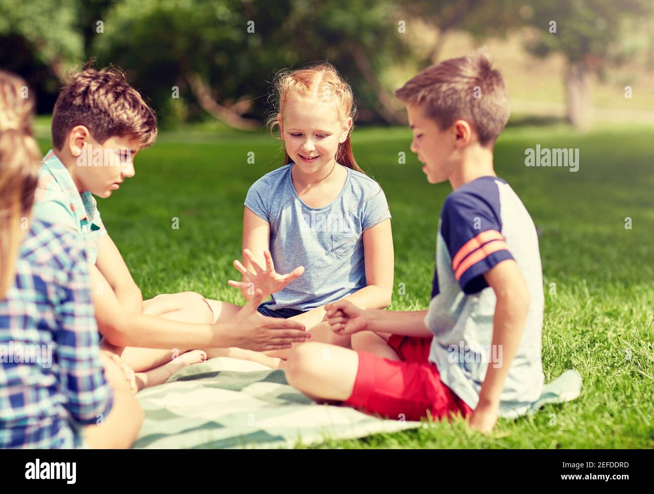 happy kids playing rock-paper-scissors game Stock Photo - Alamy