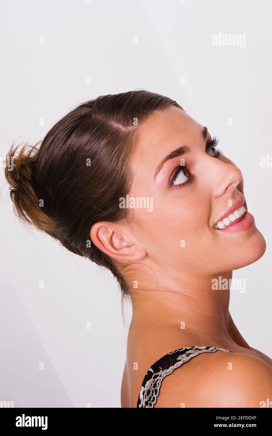 Side profile of a young woman smiling Stock Photo - Alamy