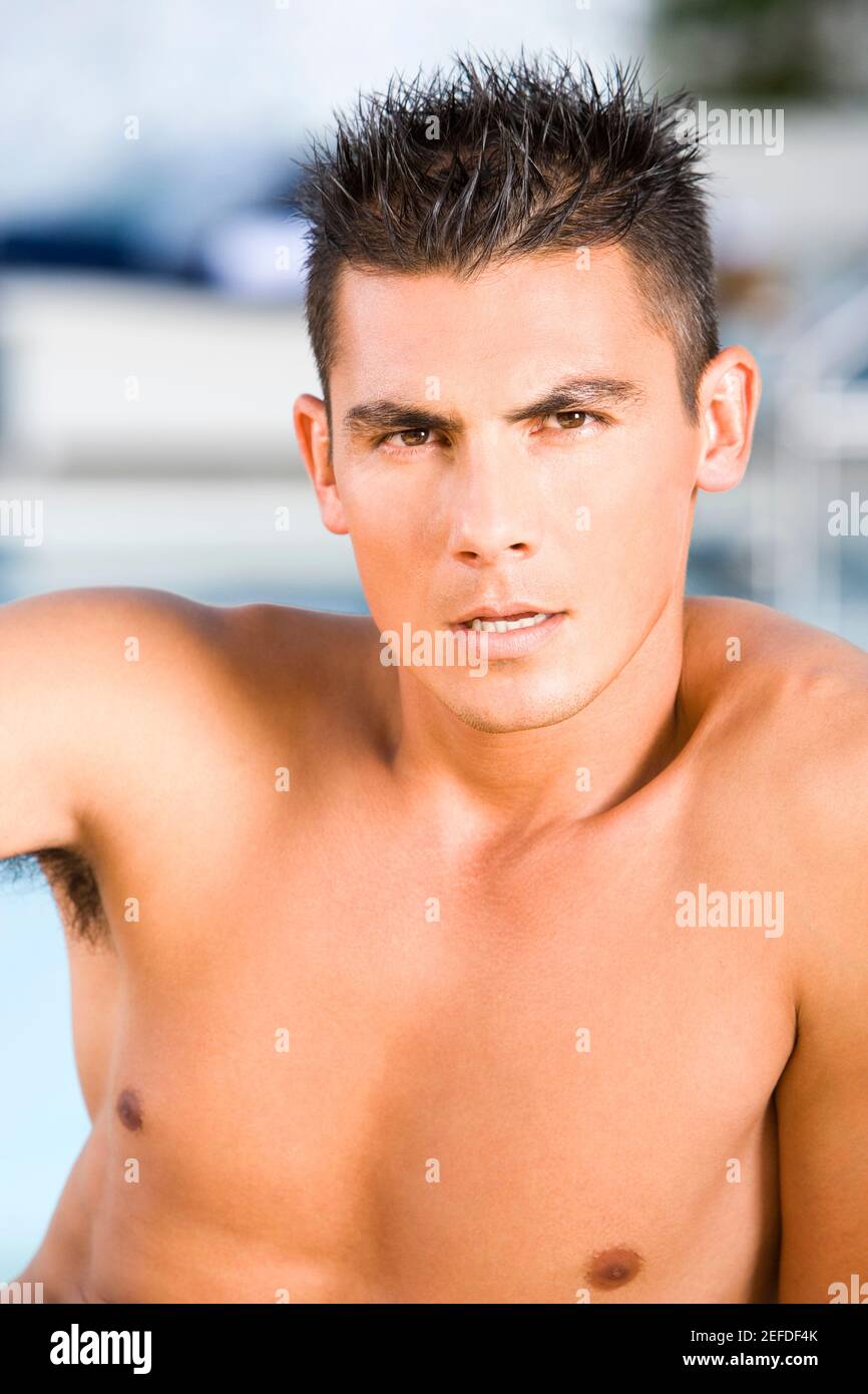 Portrait of a young man looking serious Stock Photo - Alamy
