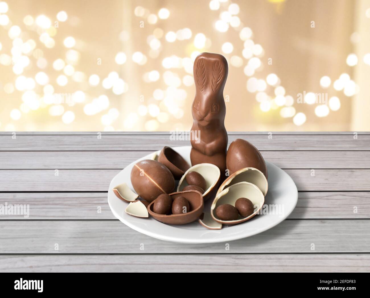 chocolate bunny, eggs and candies on plate Stock Photo - Alamy