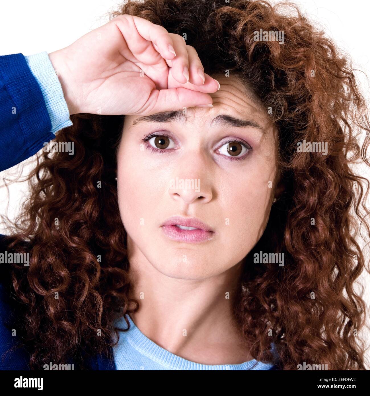 Portrait of a young woman looking worried Stock Photo - Alamy