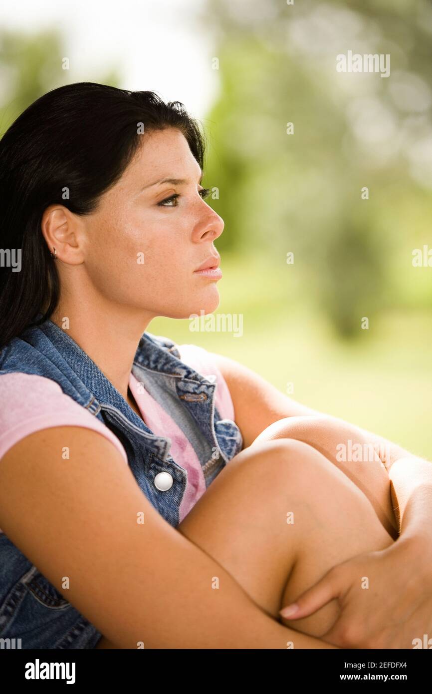 Side profile of a young woman looking serious Stock Photo - Alamy