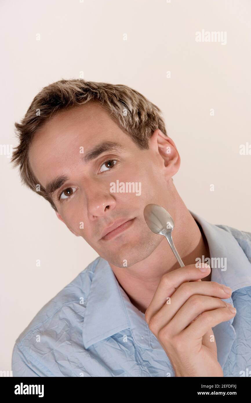 Man holding a spoon hi-res stock photography and images - Alamy