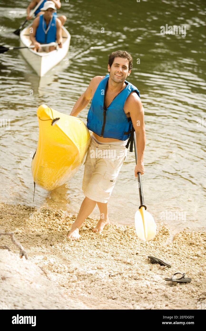 Man standing on a canoe hi-res stock photography and images - Alamy