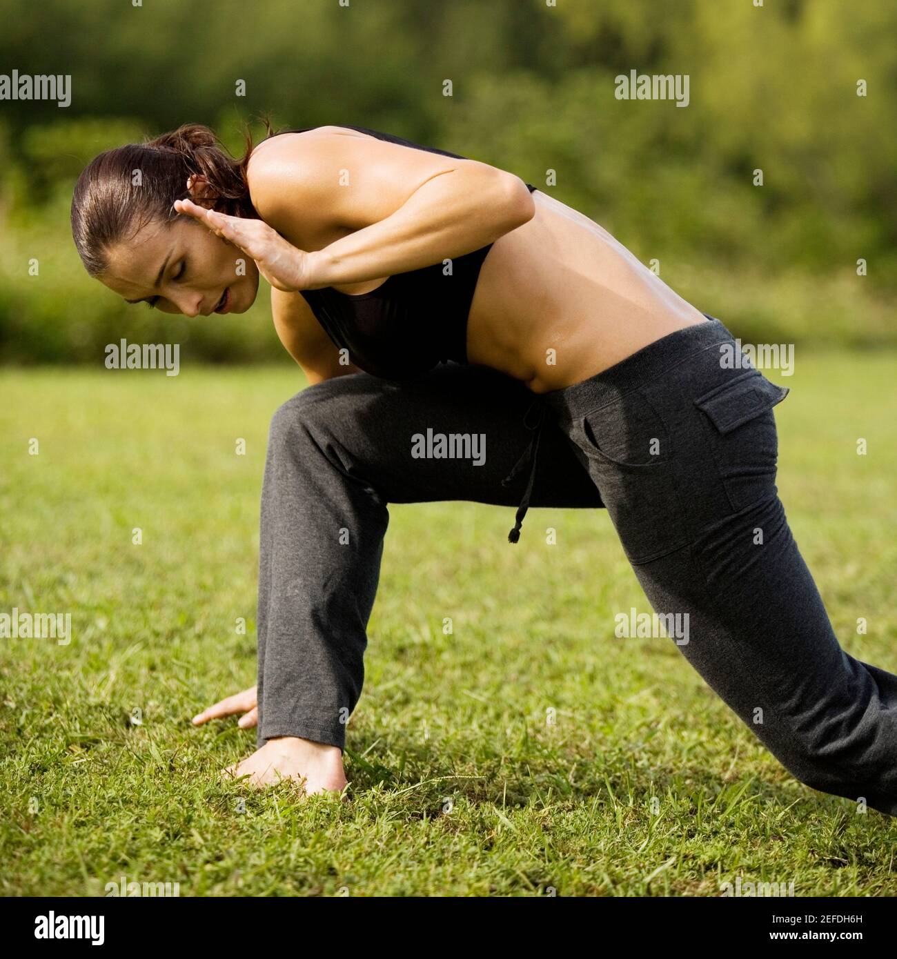 Side profile of a young woman practicing martial arts Stock Photo - Alamy