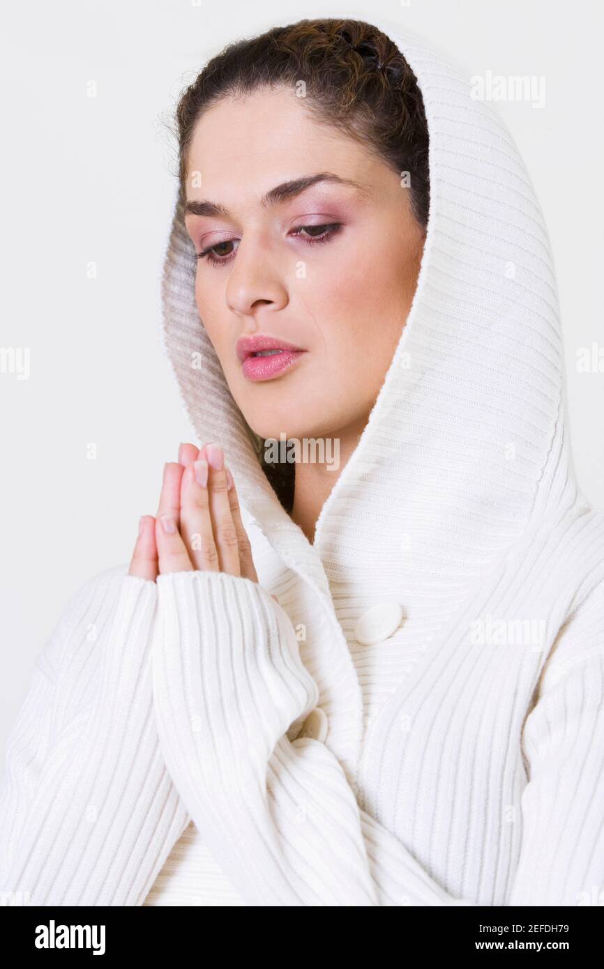 Adult female brown praying hi-res stock photography and images - Alamy