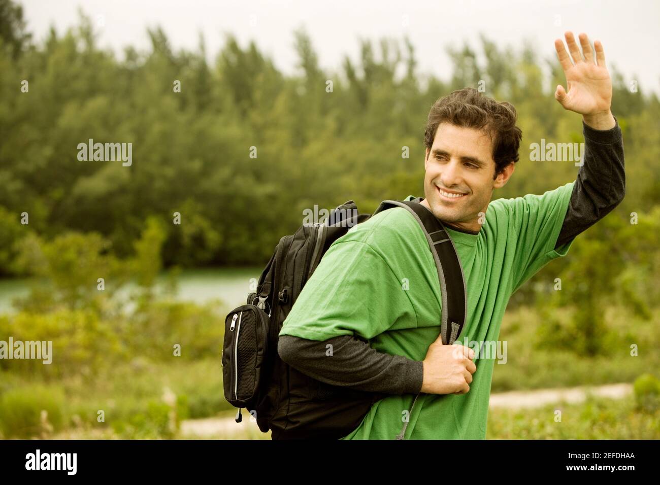 Back view of a man waving hi-res stock photography and images - Alamy